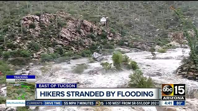 Crews rescue 17 hikers trapped by flash flood at Tanque Verde Falls ...