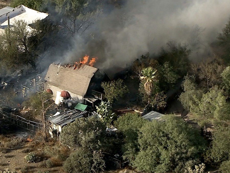 Firefighters battle house fire in Cave Creek that burned 5 acres of ...