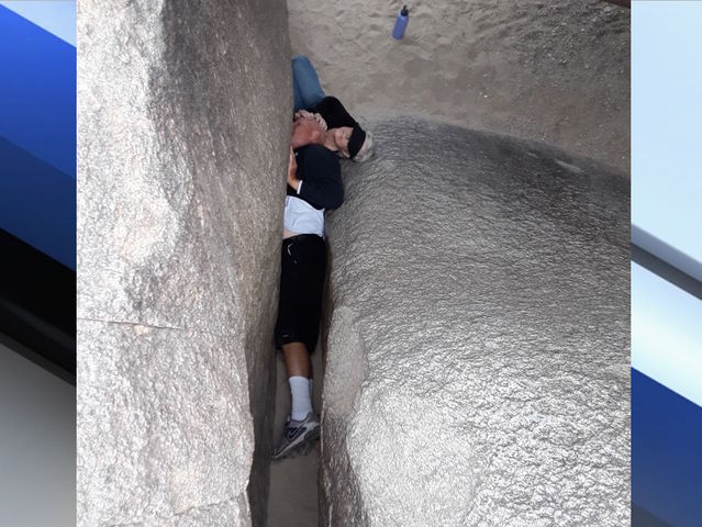 Phoenix fire crews rescue man stuck between two large rocks on South ...